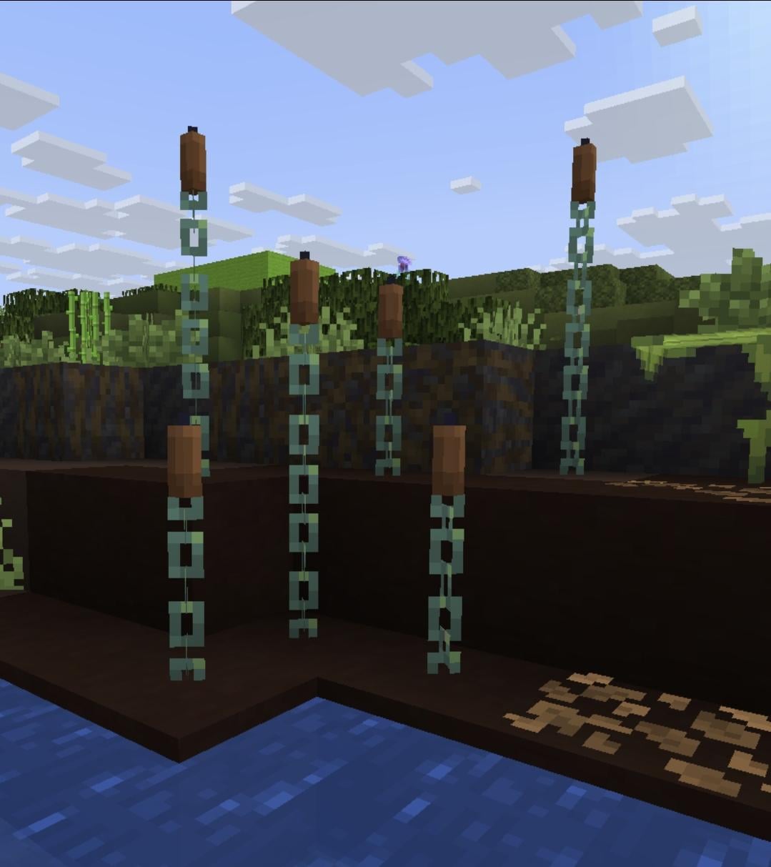 I made Cattails with weathered copper chains and brown candles ...